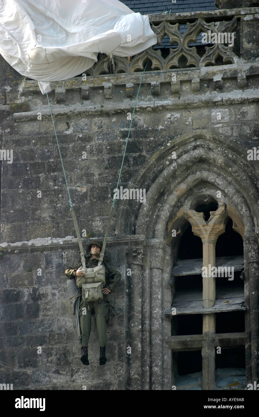 Ste Mère Eglise with a dummy of parachutist John Steele who landed on ...