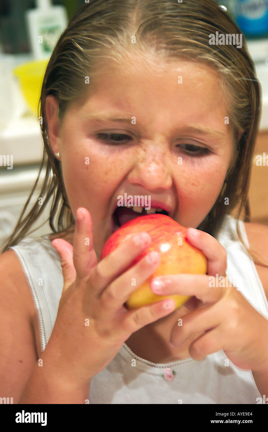 girl eating apple Stock Photo - Alamy