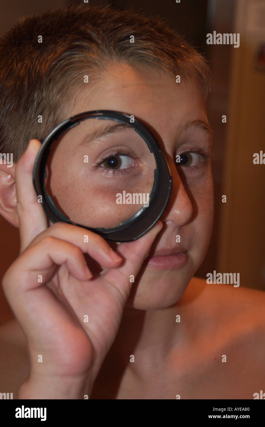 boy looking through object Stock Photo - Alamy