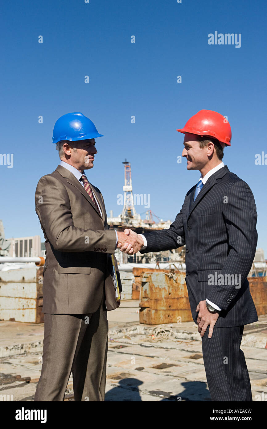 Engineers shaking hands Stock Photo - Alamy