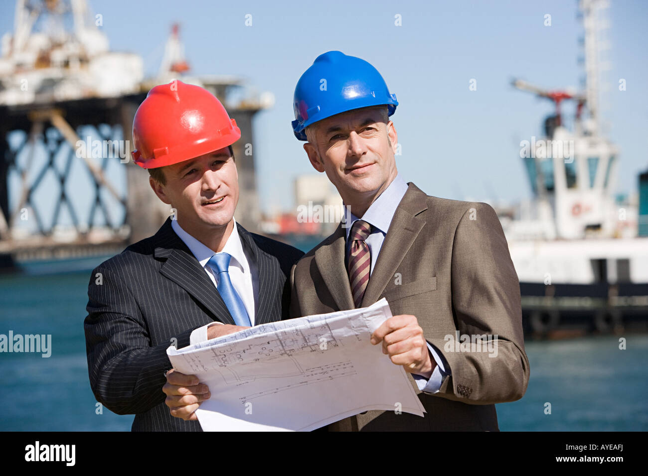Engineers at harbour Stock Photo - Alamy