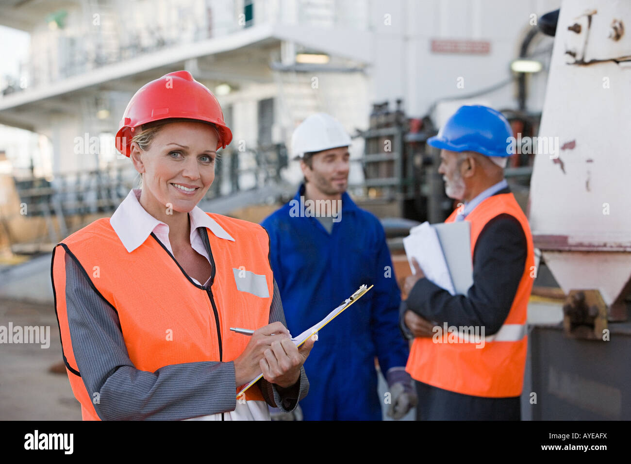 Workers at harbour Stock Photo - Alamy