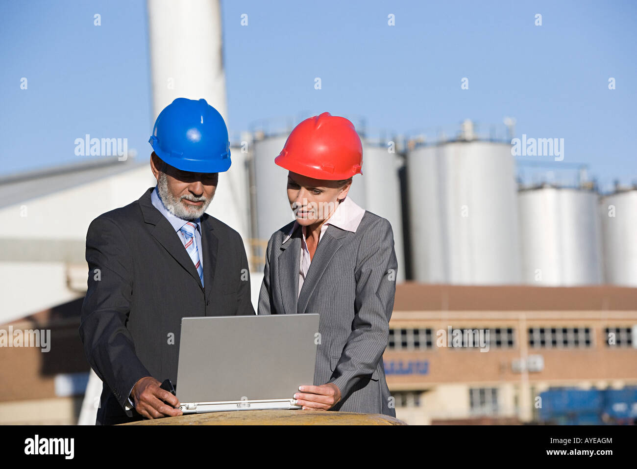 Engineers with laptop Stock Photo - Alamy