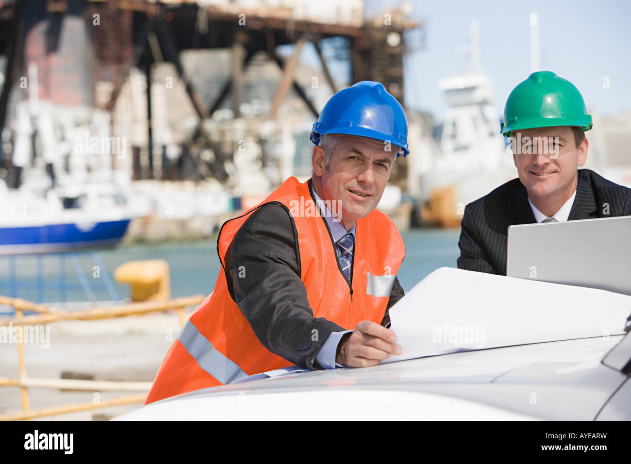Engineers at harbour Stock Photo - Alamy