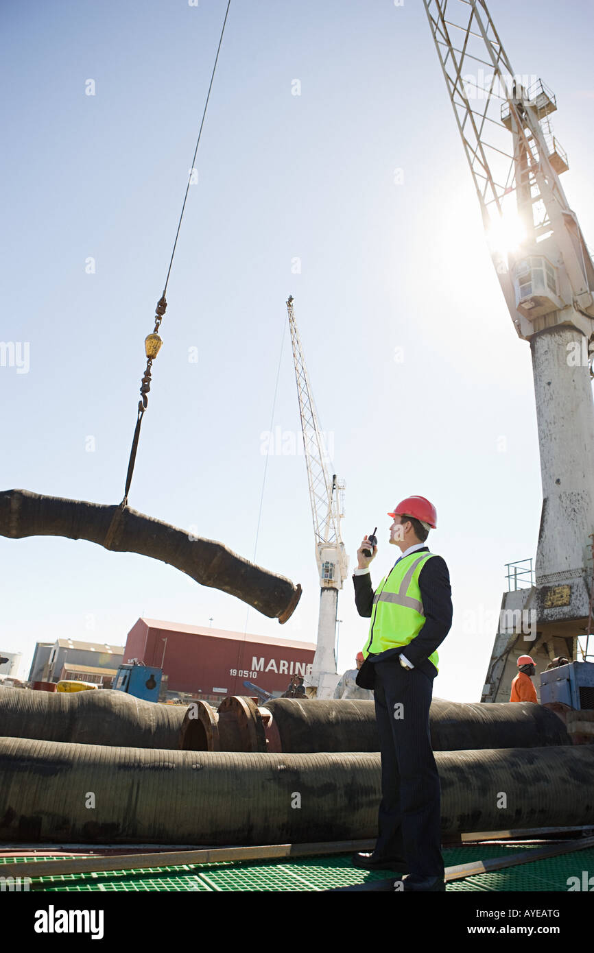 Crane lifting pipes hi-res stock photography and images - Alamy