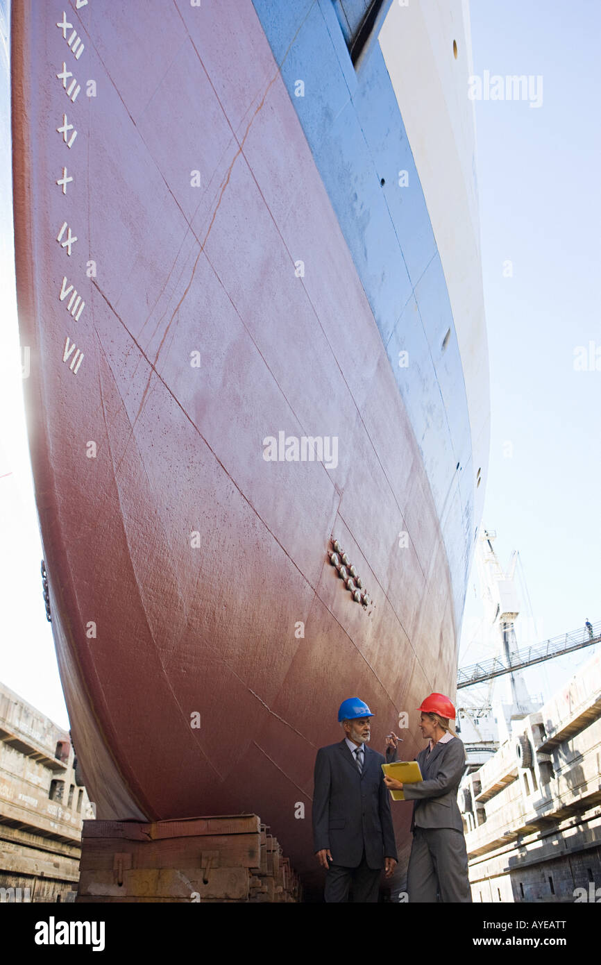 Engineers by ship Stock Photo - Alamy