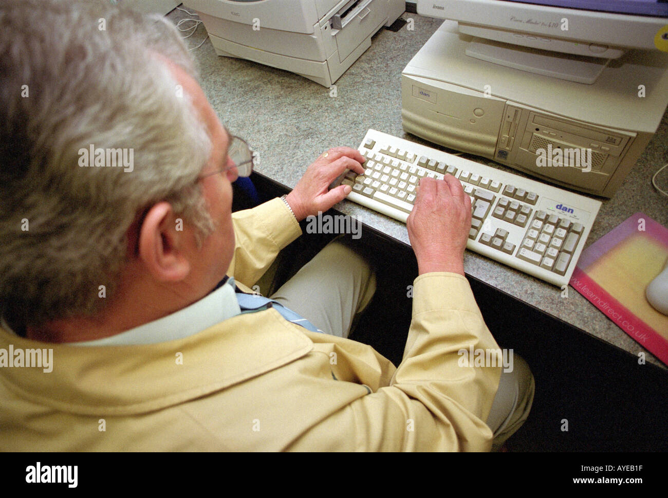 ITC4 Elderly man using computer Stock Photo - Alamy