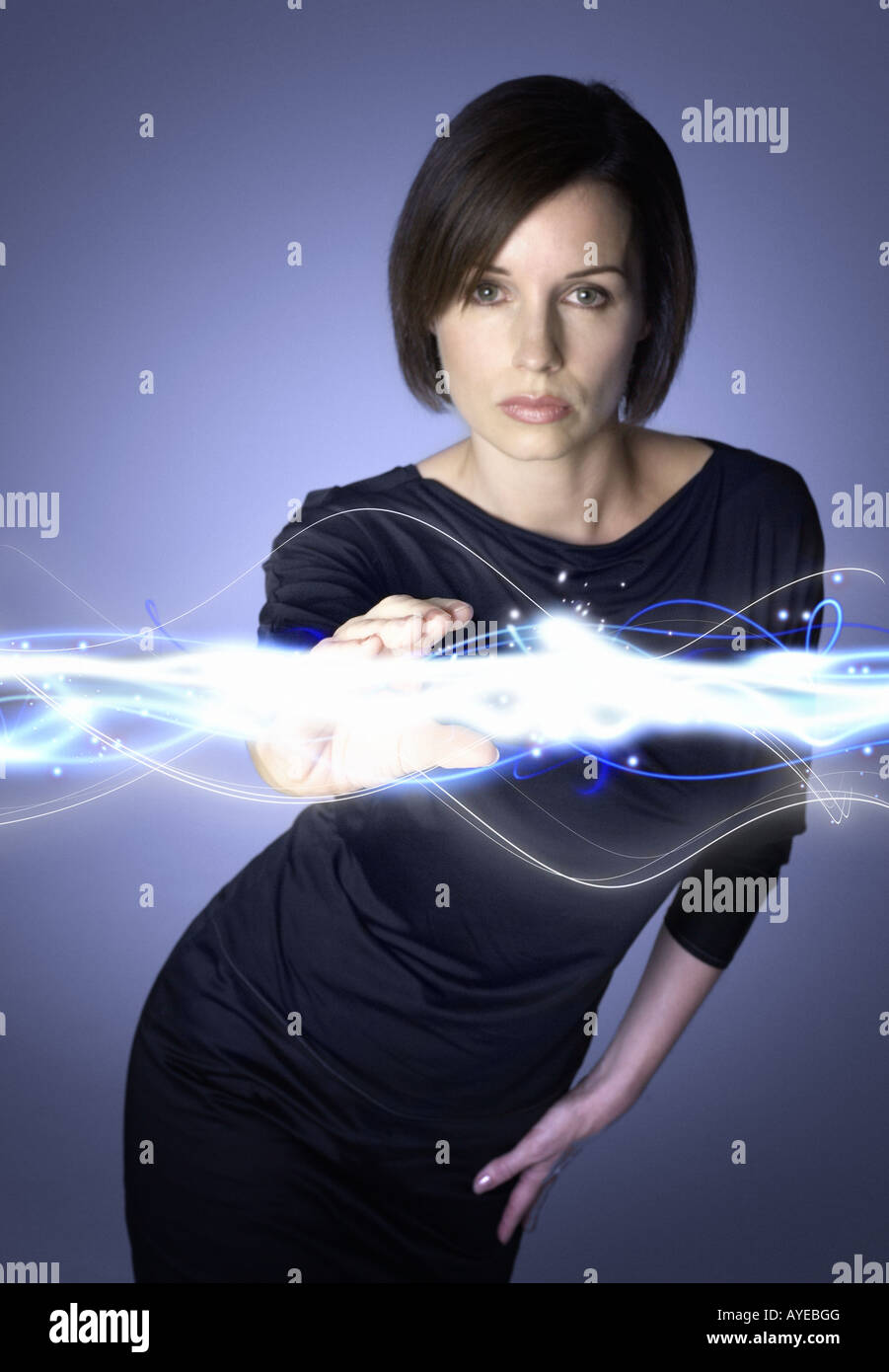 Woman touching light Stock Photo - Alamy