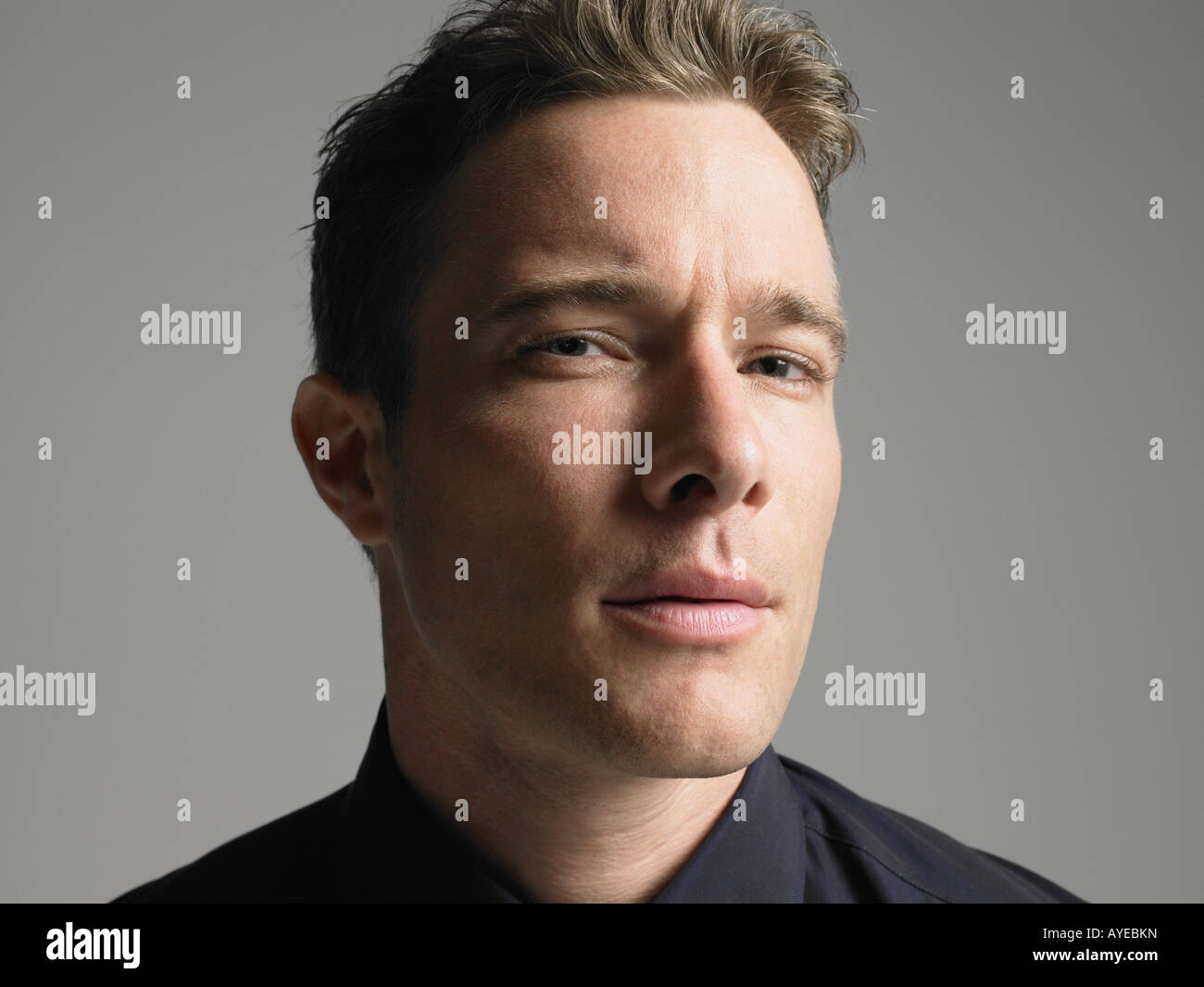 Young man looking uncertain Stock Photo - Alamy