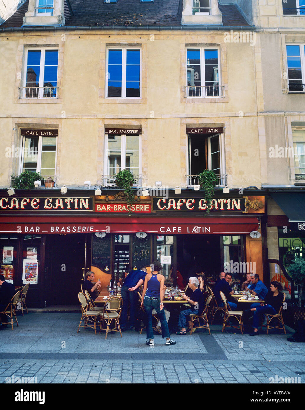People eating and drinking on the terraces at entrance of Café Latin in ...