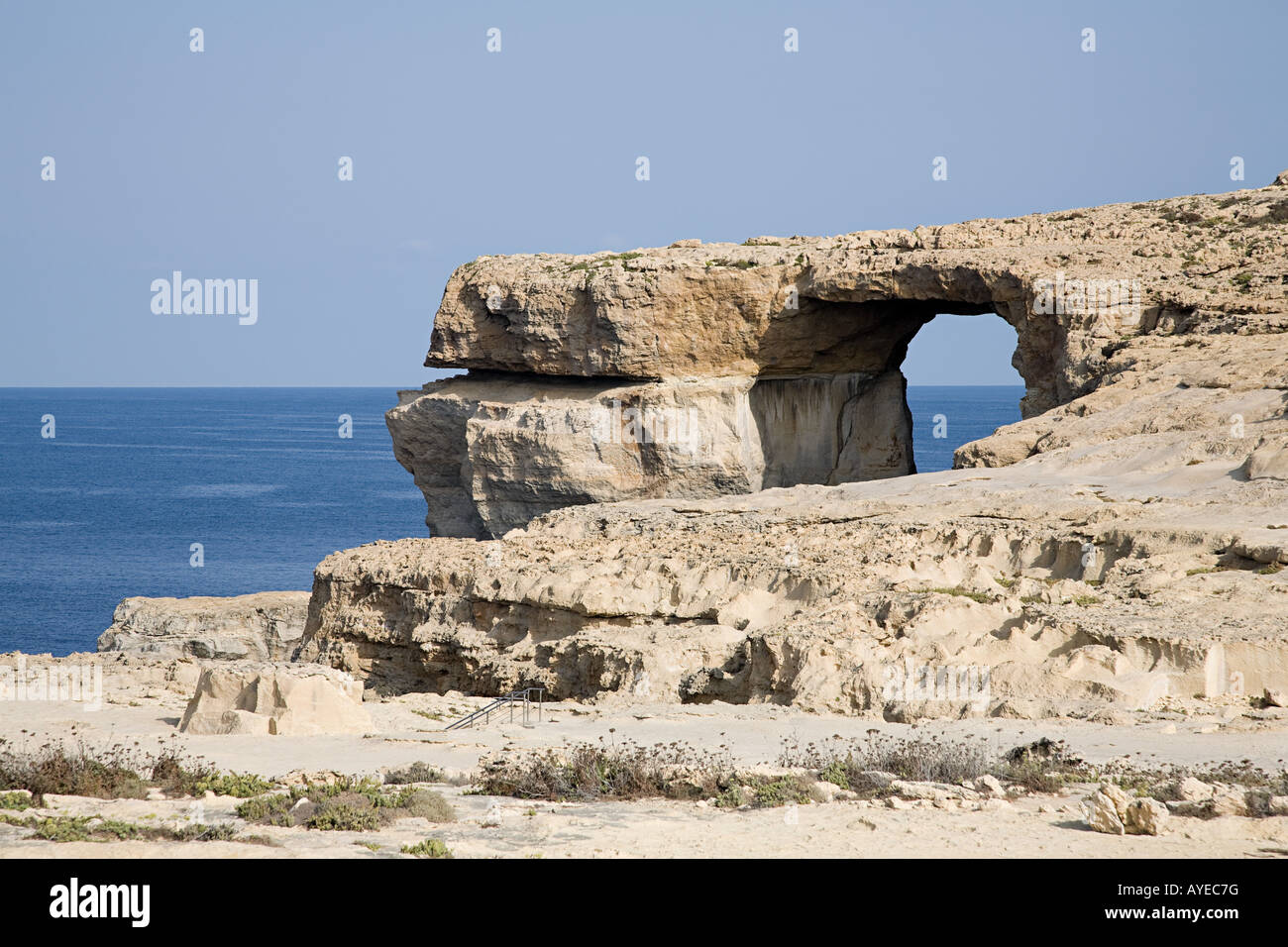 Arch in a cliff gozo malta Stock Photo - Alamy