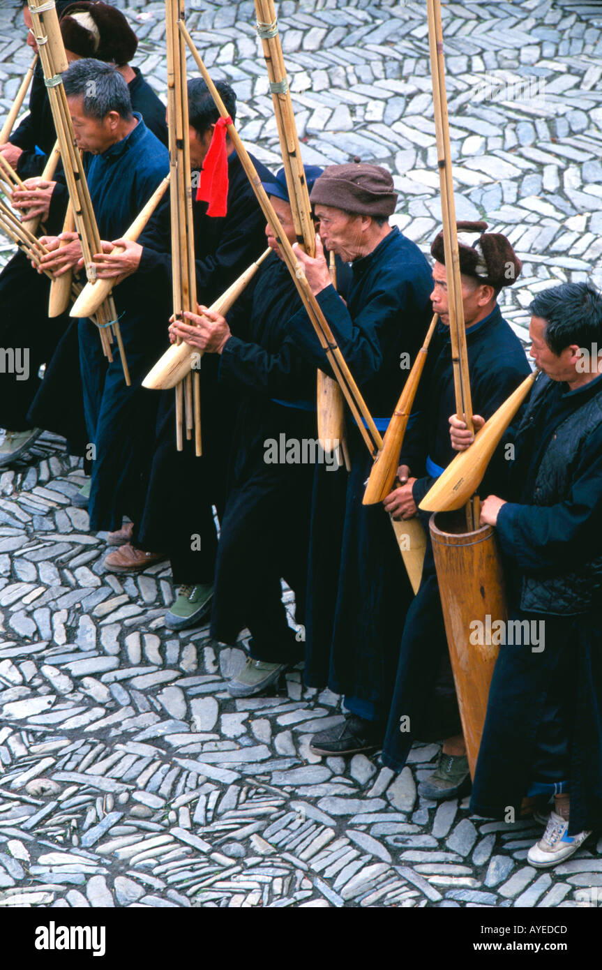 Miao men blowing Sheng traditional Chinese musical instrument in the ...