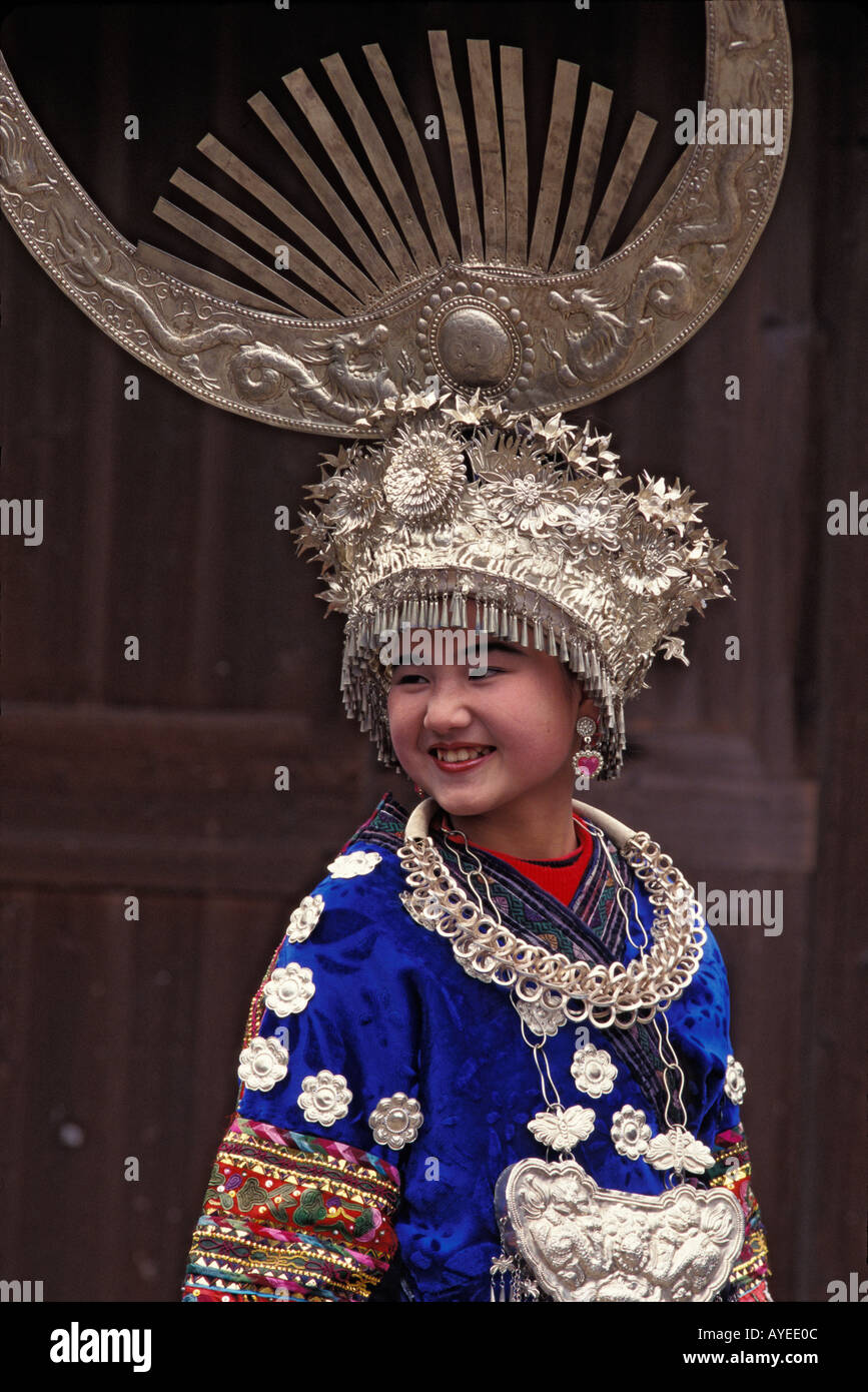 Miao girl in traditional silver hairdress and costume Kaili Guizhou ...