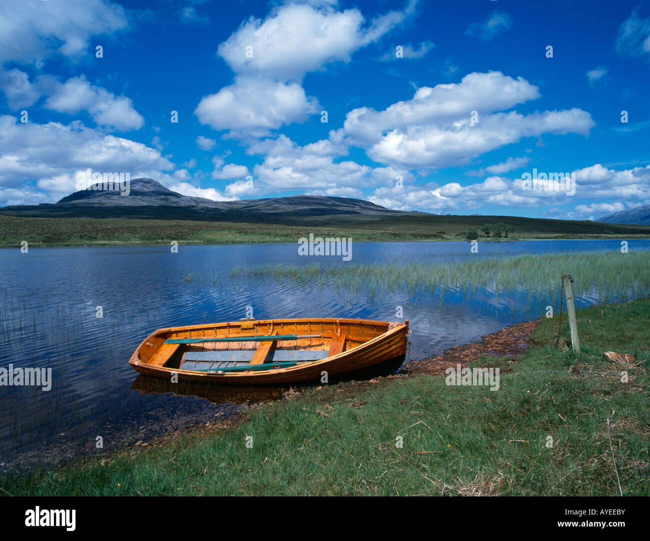 wooden rowing boat on loch, scottish highlands, scotland Stock Photo ...