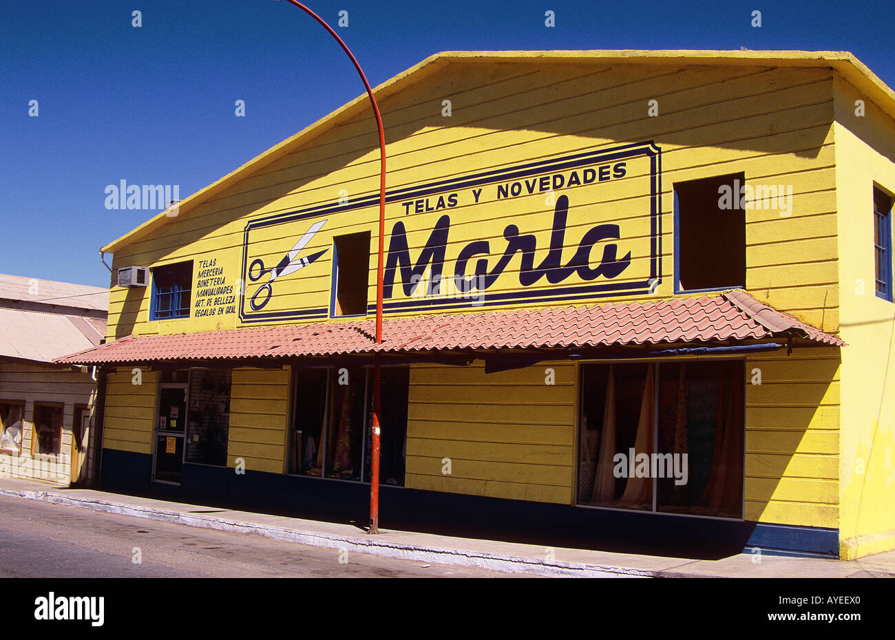 Exterior of bright yellow Clapboard building in Santa Rosalia Stock ...