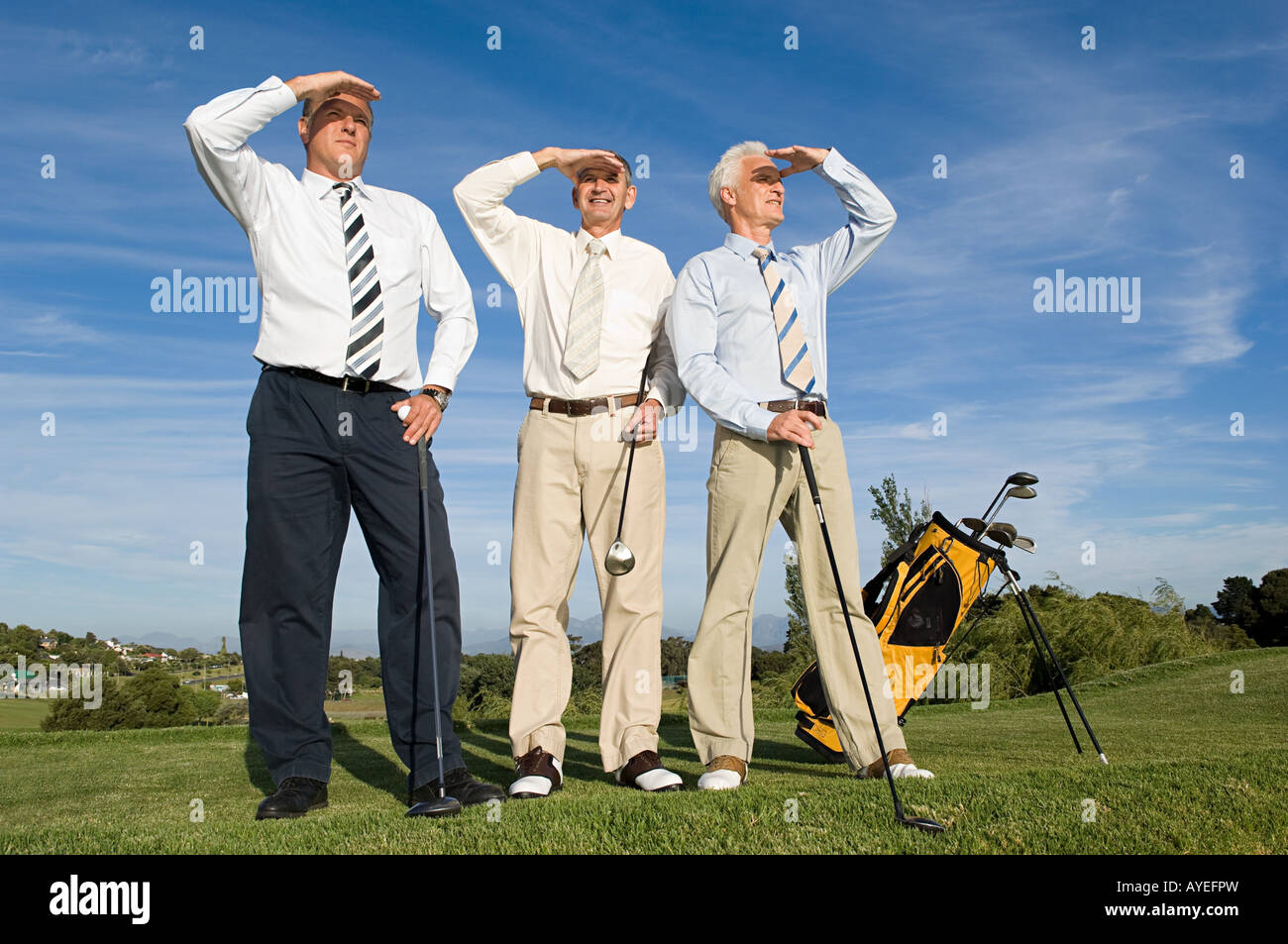 Businessmen playing golf Stock Photo - Alamy
