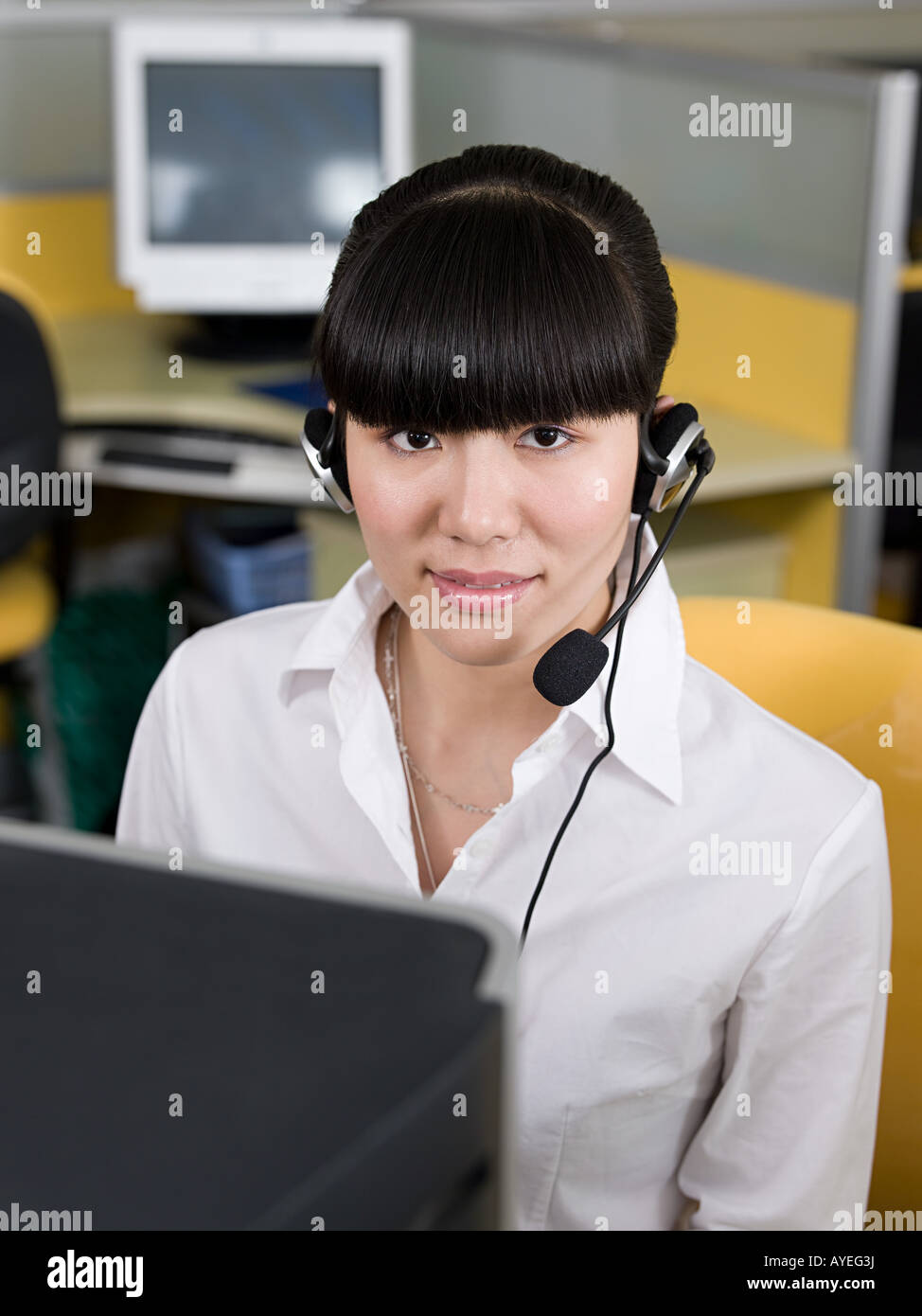 Office worker with headset Stock Photo - Alamy