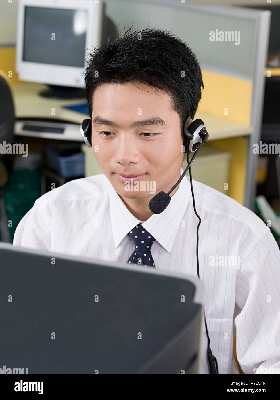 Office worker wearing headset Stock Photo - Alamy