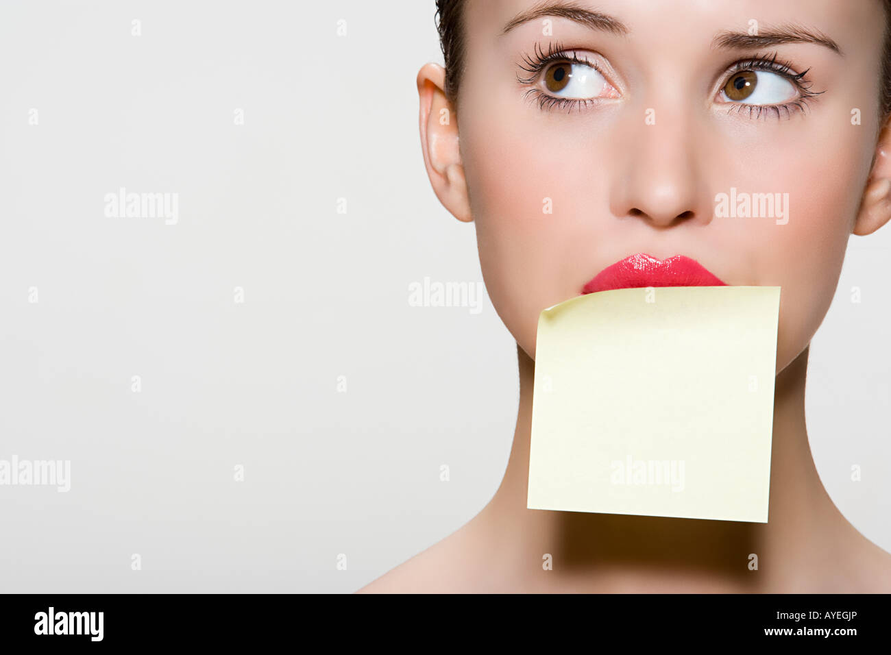 Woman with adhesive note on her mouth Stock Photo - Alamy