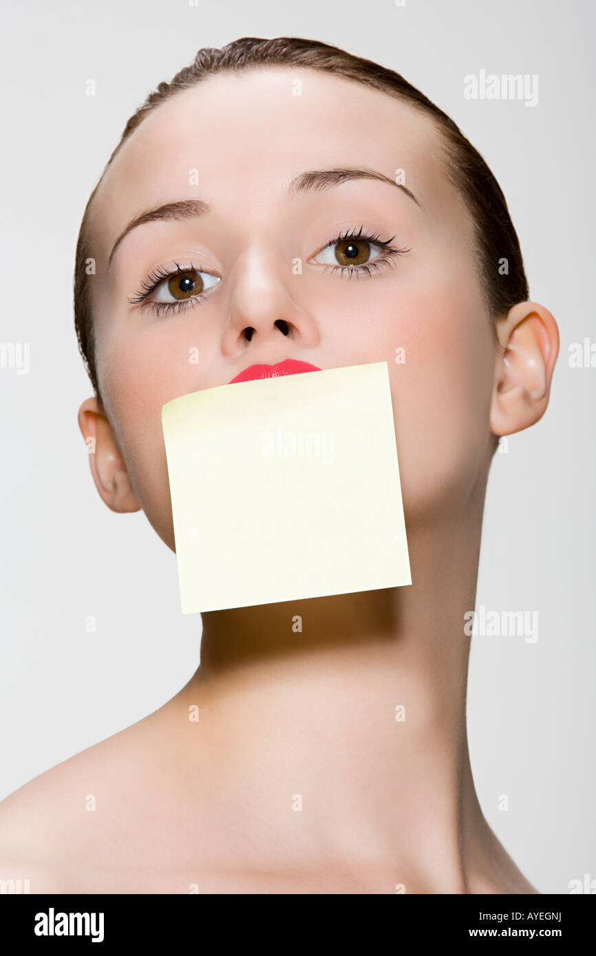 Woman with adhesive note on her mouth Stock Photo - Alamy