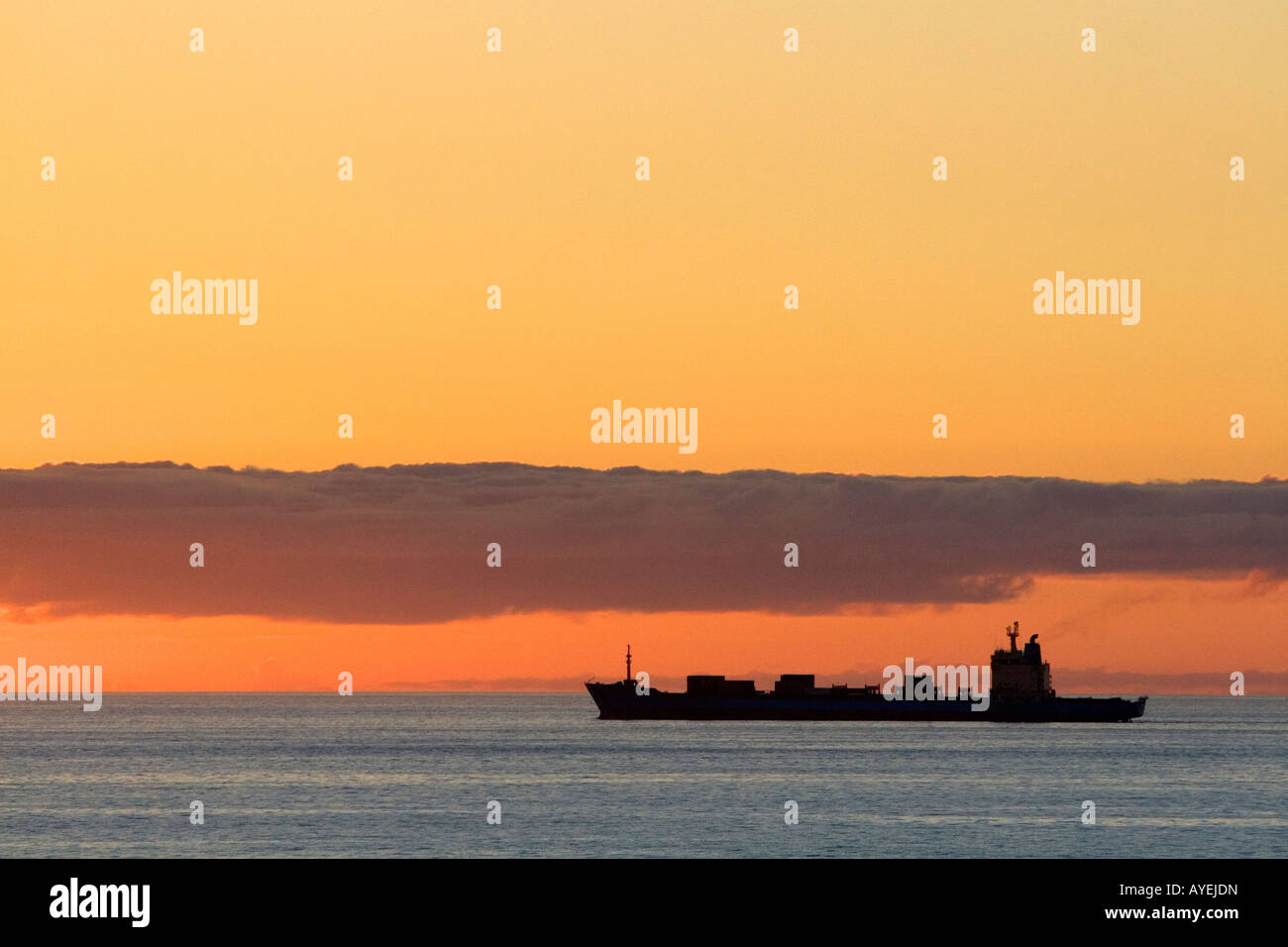 Container ship at sunset in the Pacific Ocean near Valparaiso Chile ...