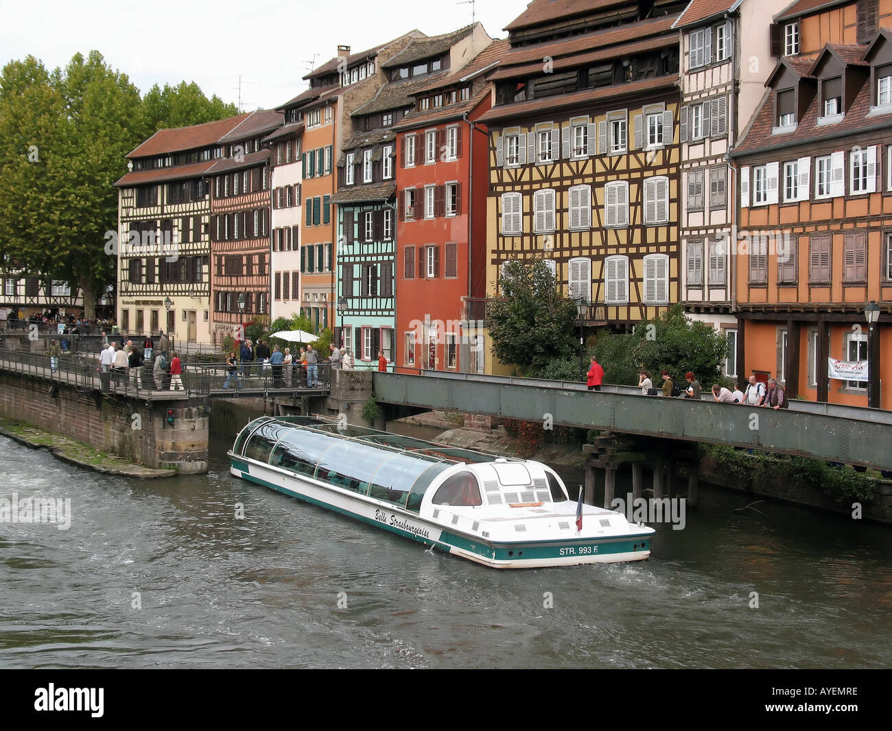 TOURIST TOUR BOAT ENTERING A LOCK ON ILL RIVER AND HALF-TIMBERED HOUSES ...