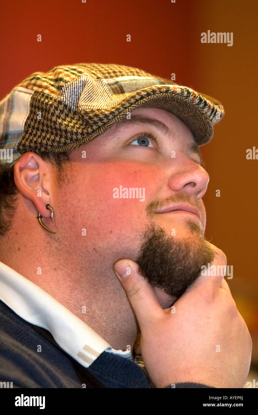 Portrait of a young man thinking Stock Photo - Alamy