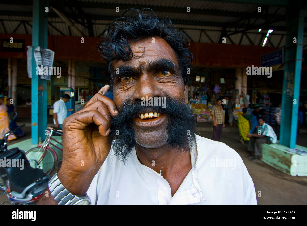 Wild Looking Man Using a Mobile Phone at the Bus Station in Pudukkottai ...