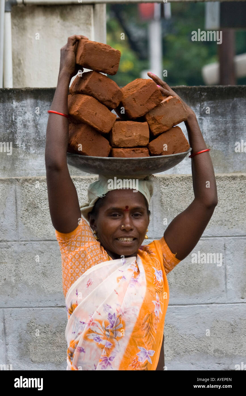 Women carrying bricks hi-res stock photography and images - Alamy