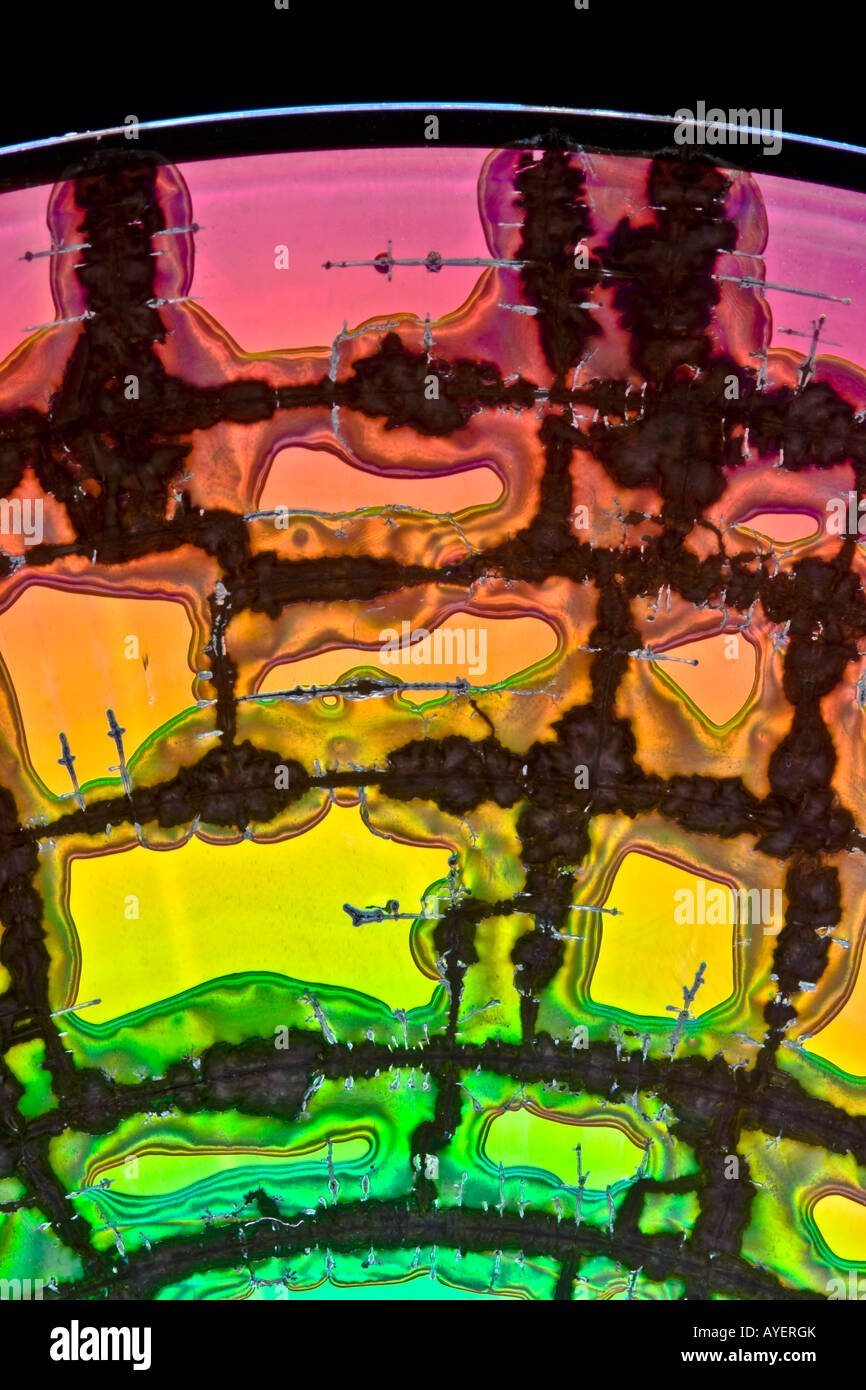 Detail of a compact disc that was placed in a microwave oven for two ...