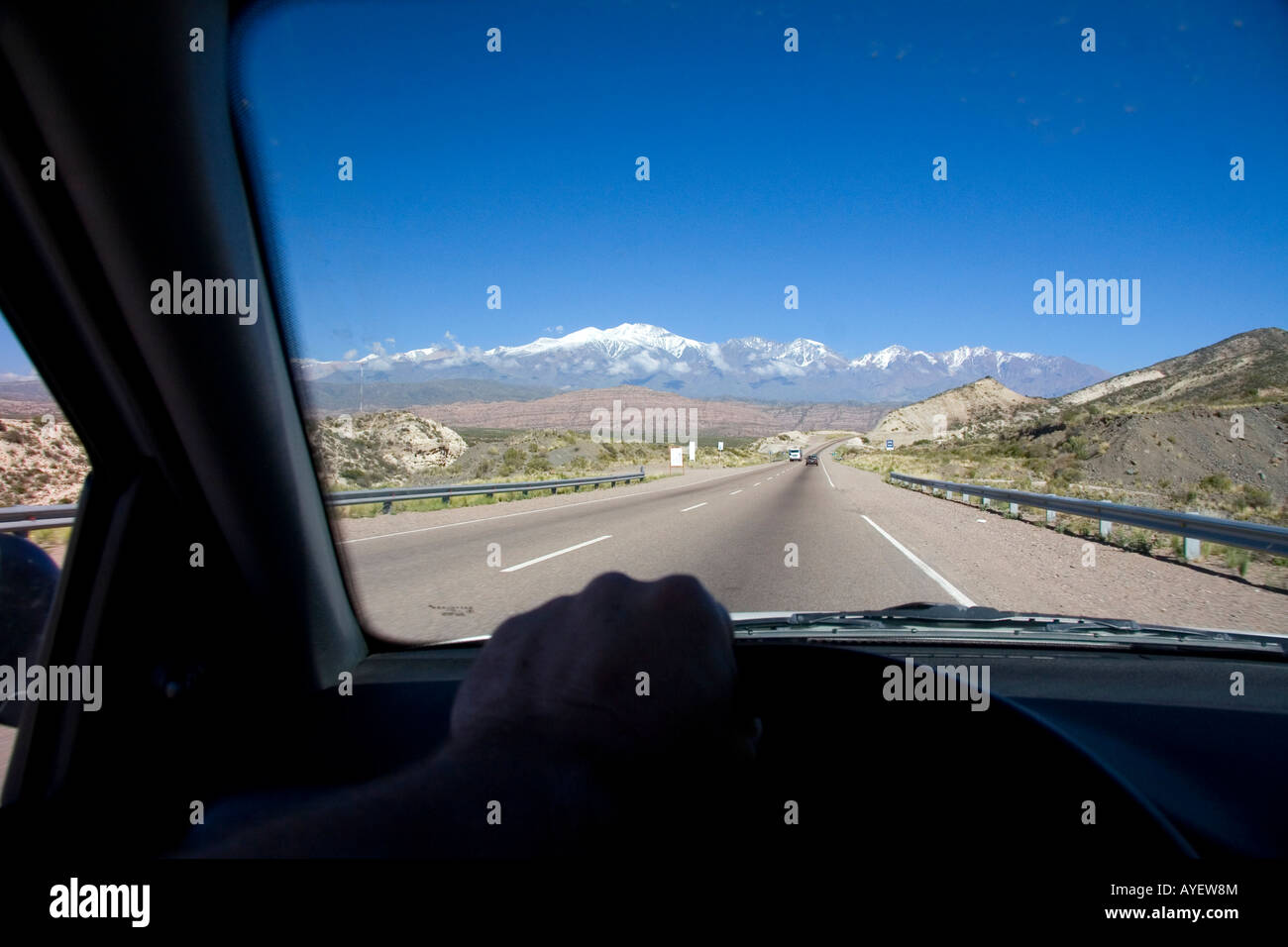 Driving on road near mountains hi-res stock photography and images - Alamy