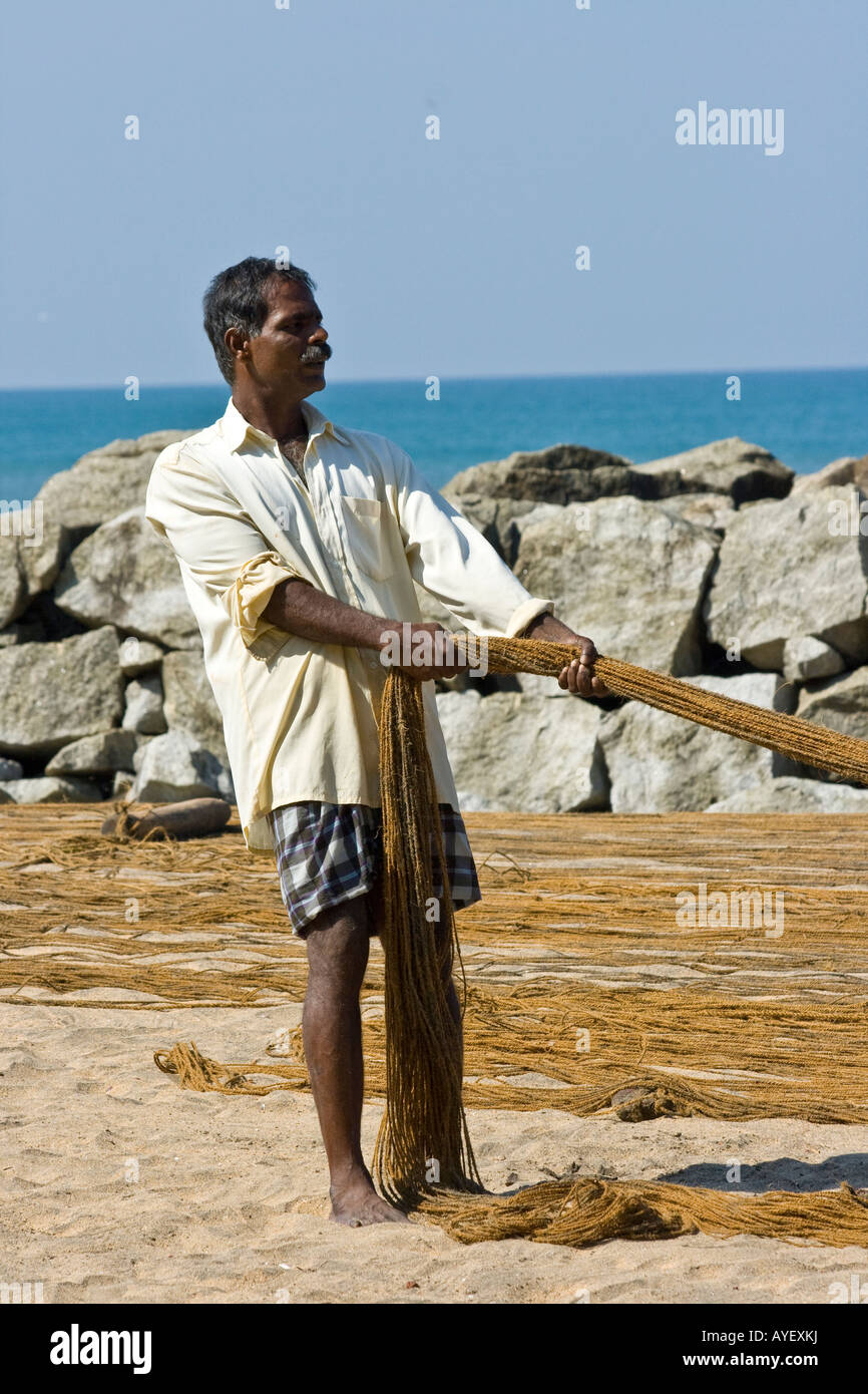 Laying out Fishing Nets to Dry in the Sun on the Beach in Varkala South ...