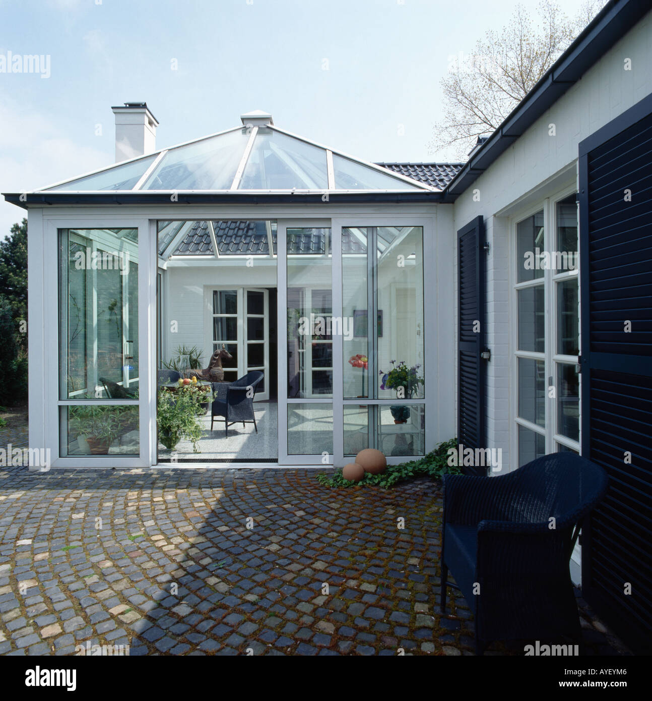 paving in front of modern glass conservatory extension Stock Photo - Alamy