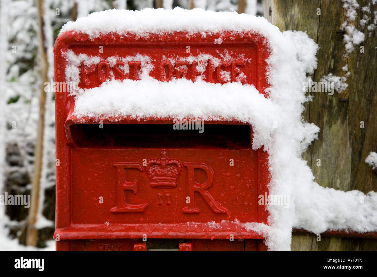Royal Mail red letter box covered in snow Stock Photo - Alamy