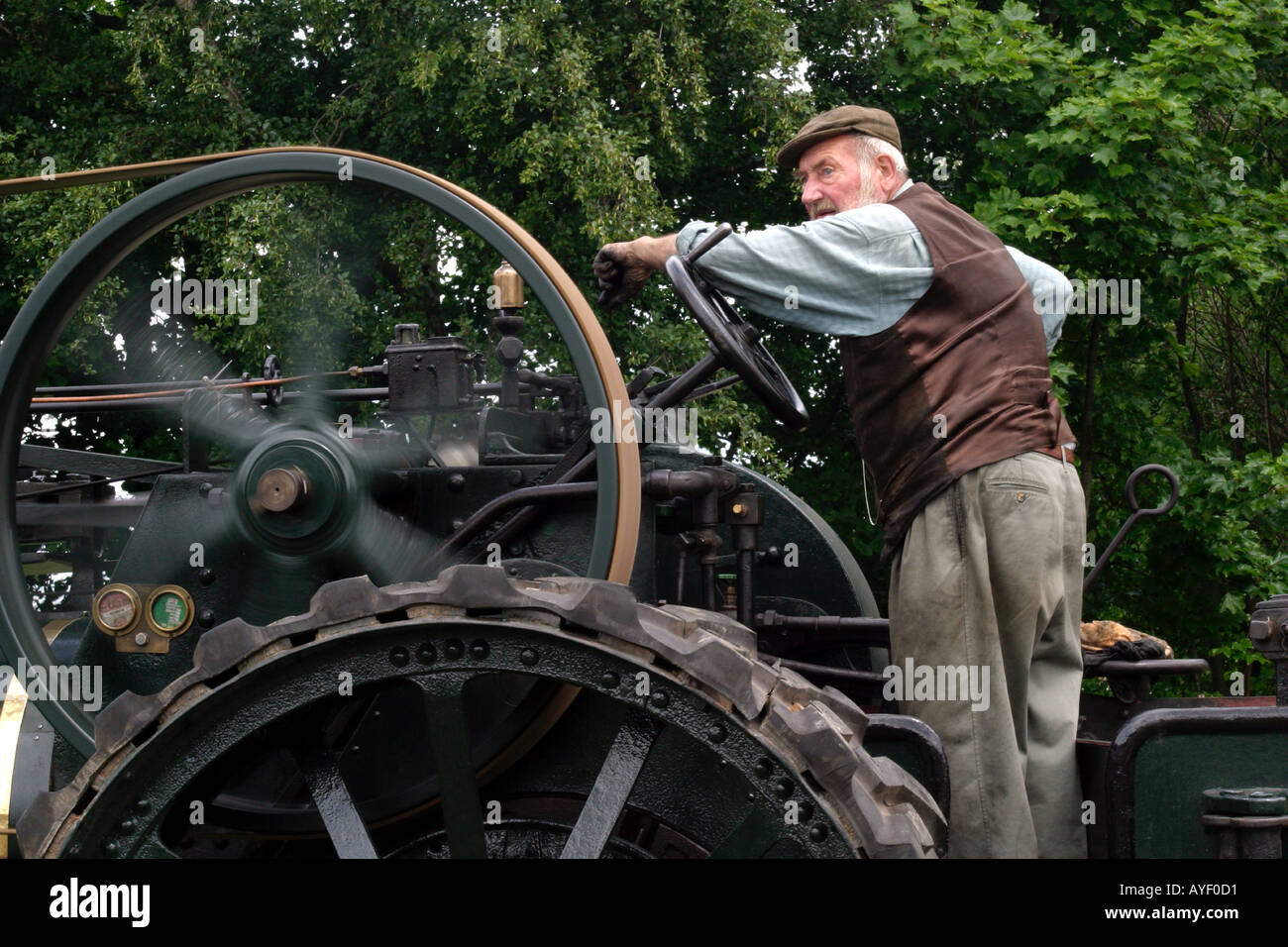 Elderly man running a traction engine Stock Photo - Alamy