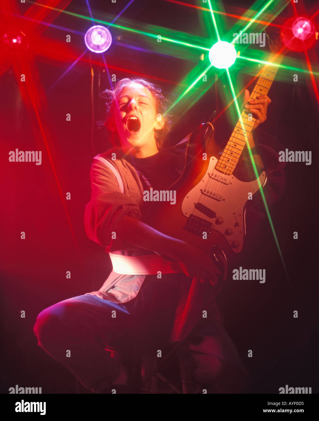 Male teenager singing playing guitar hi-res stock photography and ...