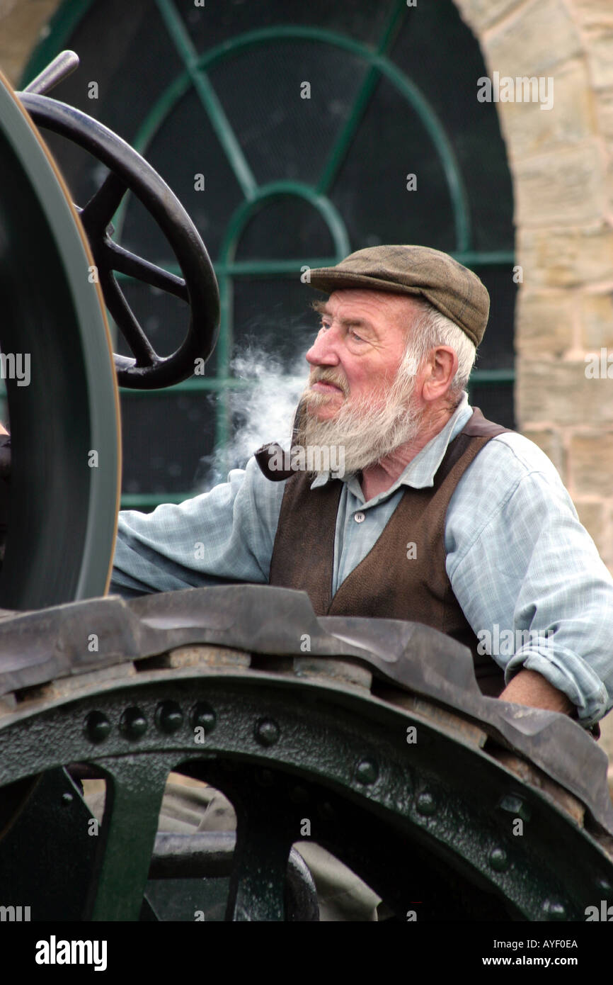 Elderly man running a traction engine Stock Photo - Alamy