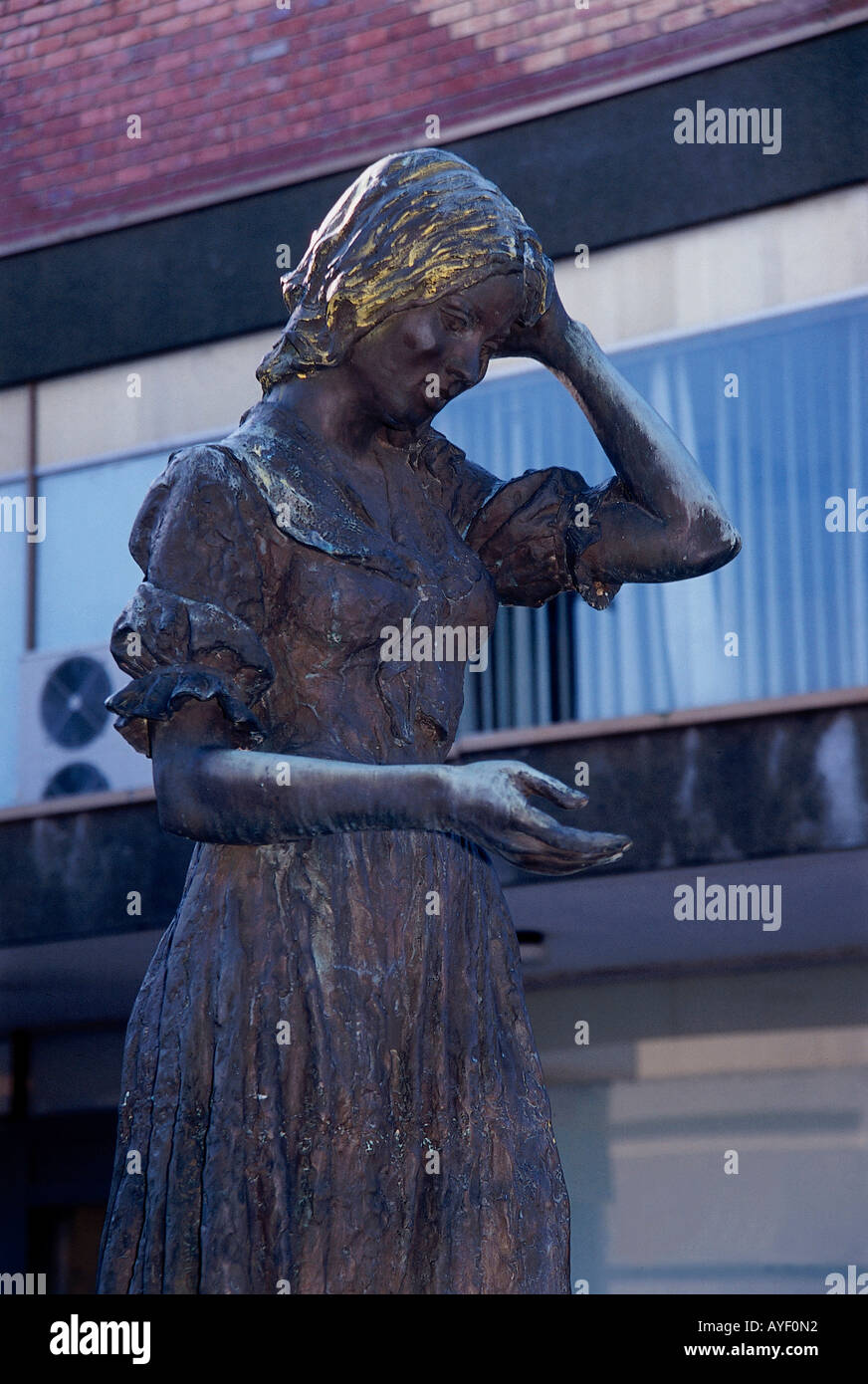 Detail of a statue of a Voortrekker Girl in Plein Street Rustenburg ...