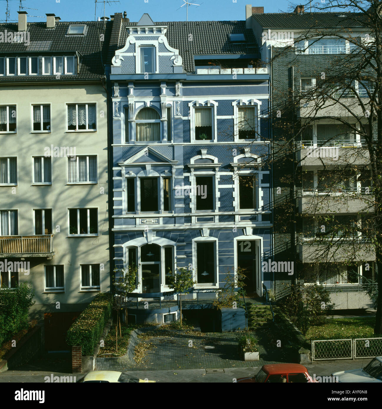 Tall blue house in terraced row in Germany Stock Photo - Alamy