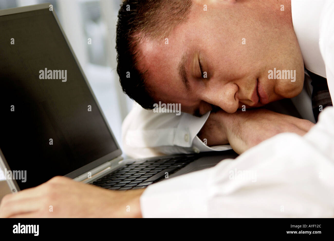 Man sleeping on laptop Stock Photo - Alamy