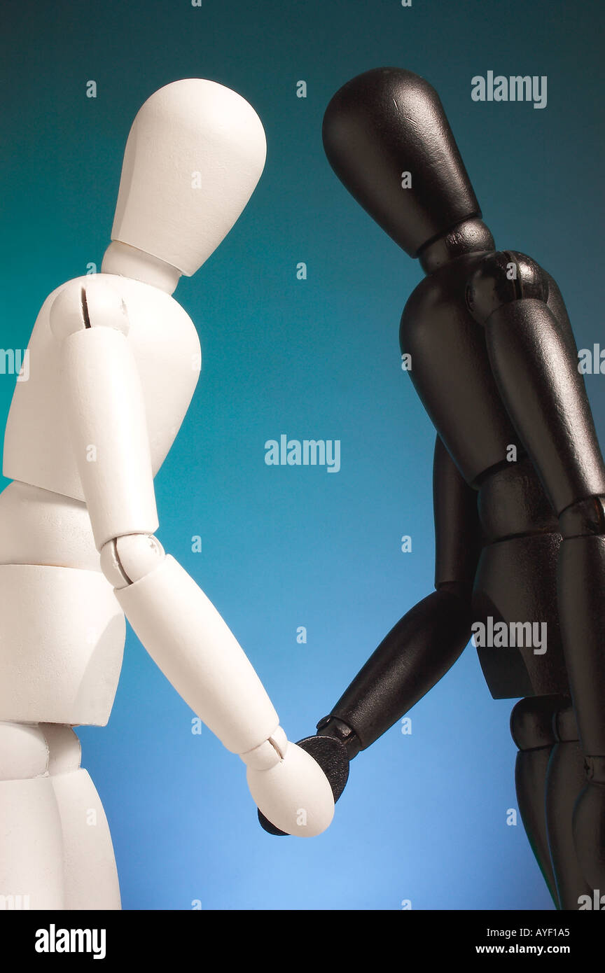 Two figures shaking hands Stock Photo - Alamy