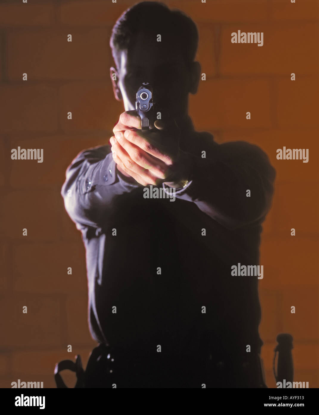 policeman aiming his pistol at camera Stock Photo - Alamy