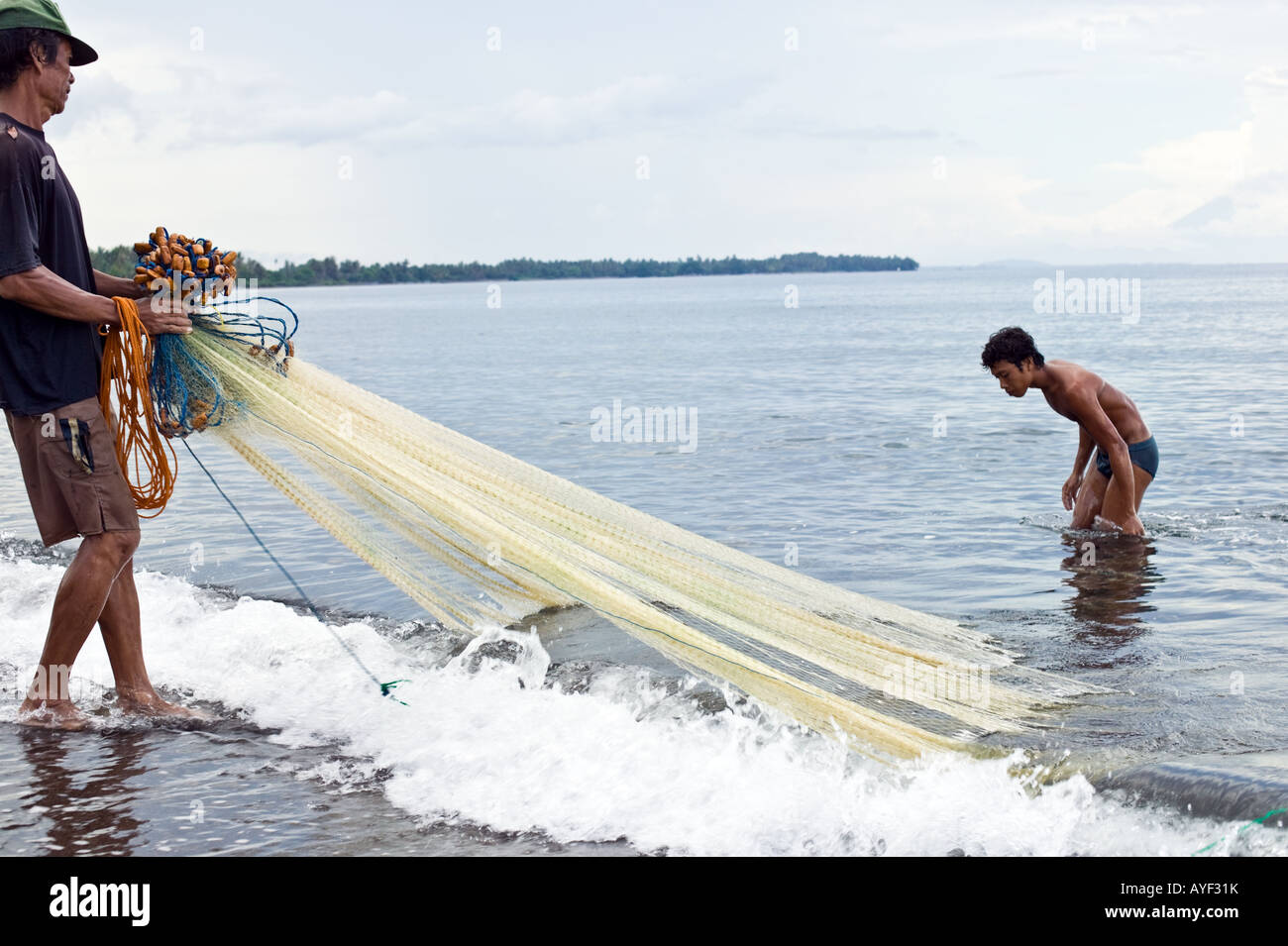 Hauling fishing nets hi-res stock photography and images - Alamy