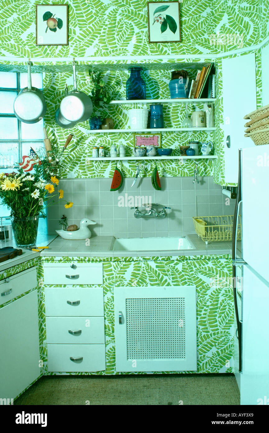 Small seventies kitchen with green wallpaper Stock Photo - Alamy