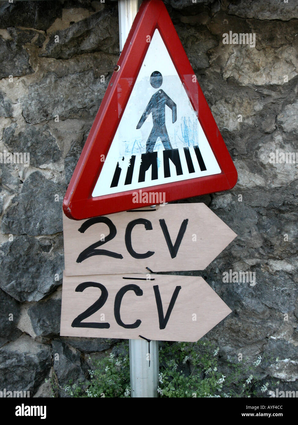 Pedestrian crossing road sign in Spain with directions to Citroen 2CV ...