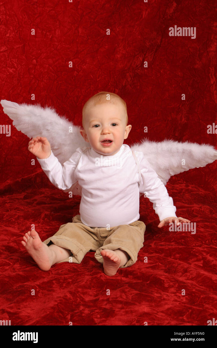 Little redhead boy angel Stock Photo - Alamy