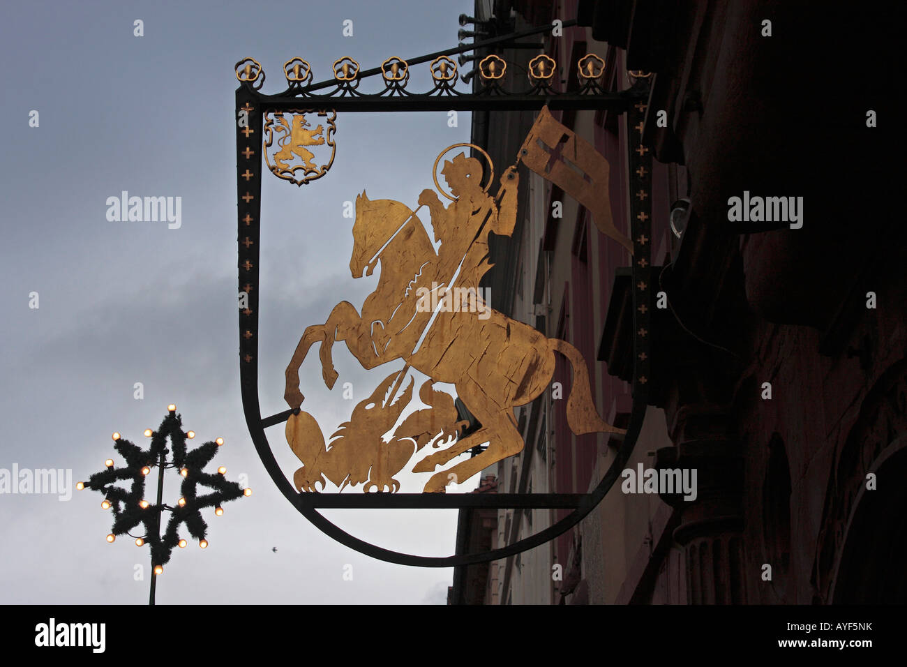 Coat of arms with golden knight on a horse in Heidelberg germany Stock ...