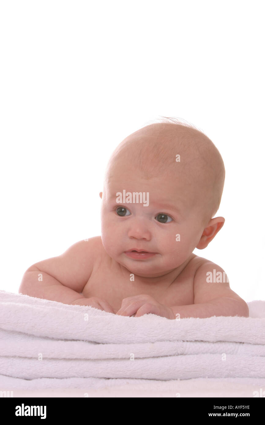 serious baby vertical on white Stock Photo - Alamy