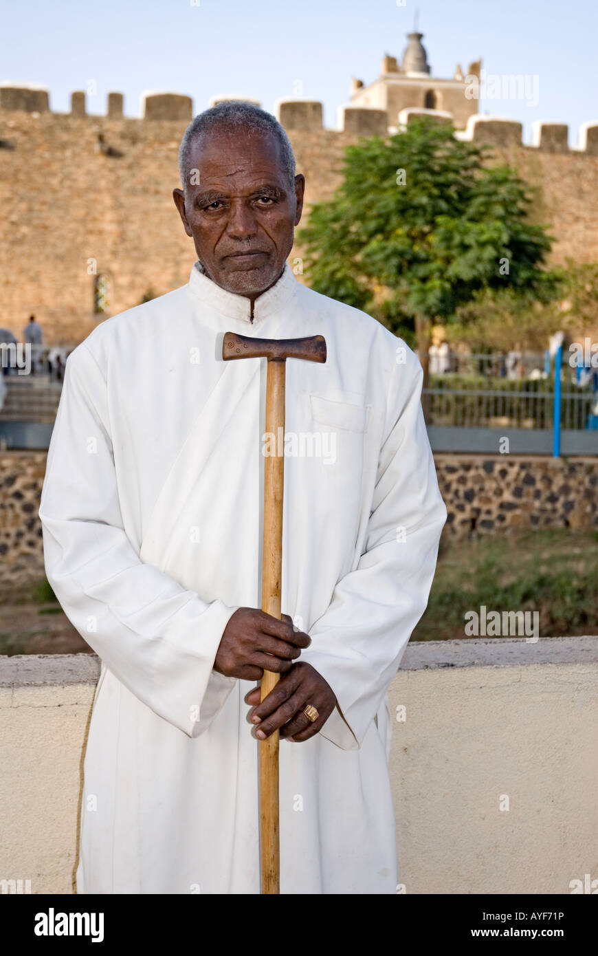 Monk with prayer staff outside St. Mary of Zion church, Axum, Ethiopia ...