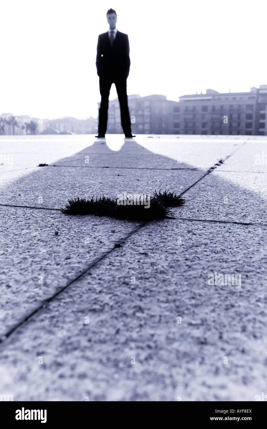 Long businessman shadow in urban background Stock Photo - Alamy